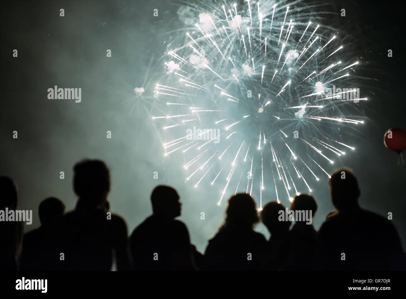 Crowd watching fireworks and celebrating Stock Photo - Alamy