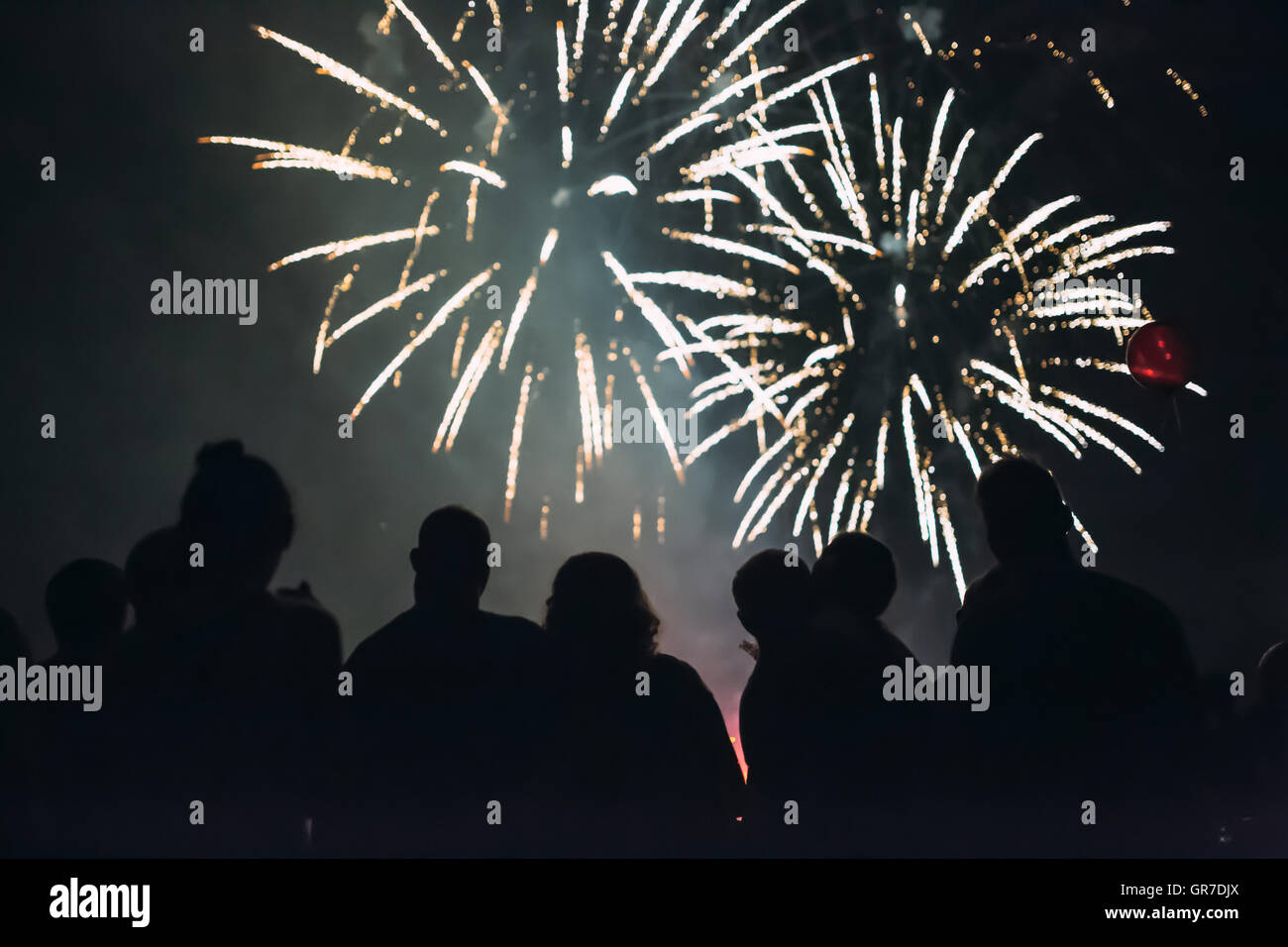 Crowd watching fireworks and celebrating Stock Photo - Alamy