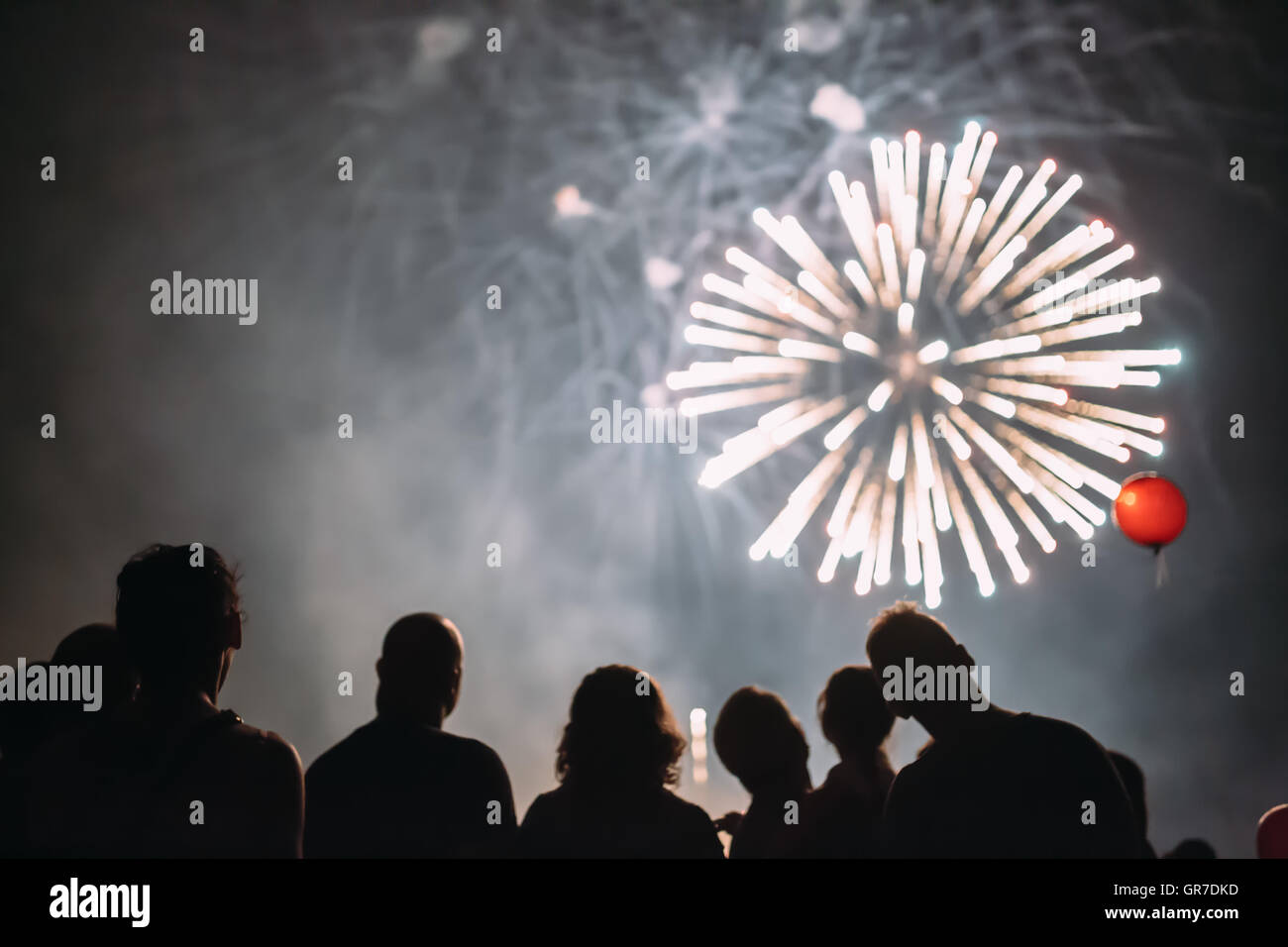 Crowd watching fireworks and celebrating Stock Photo - Alamy