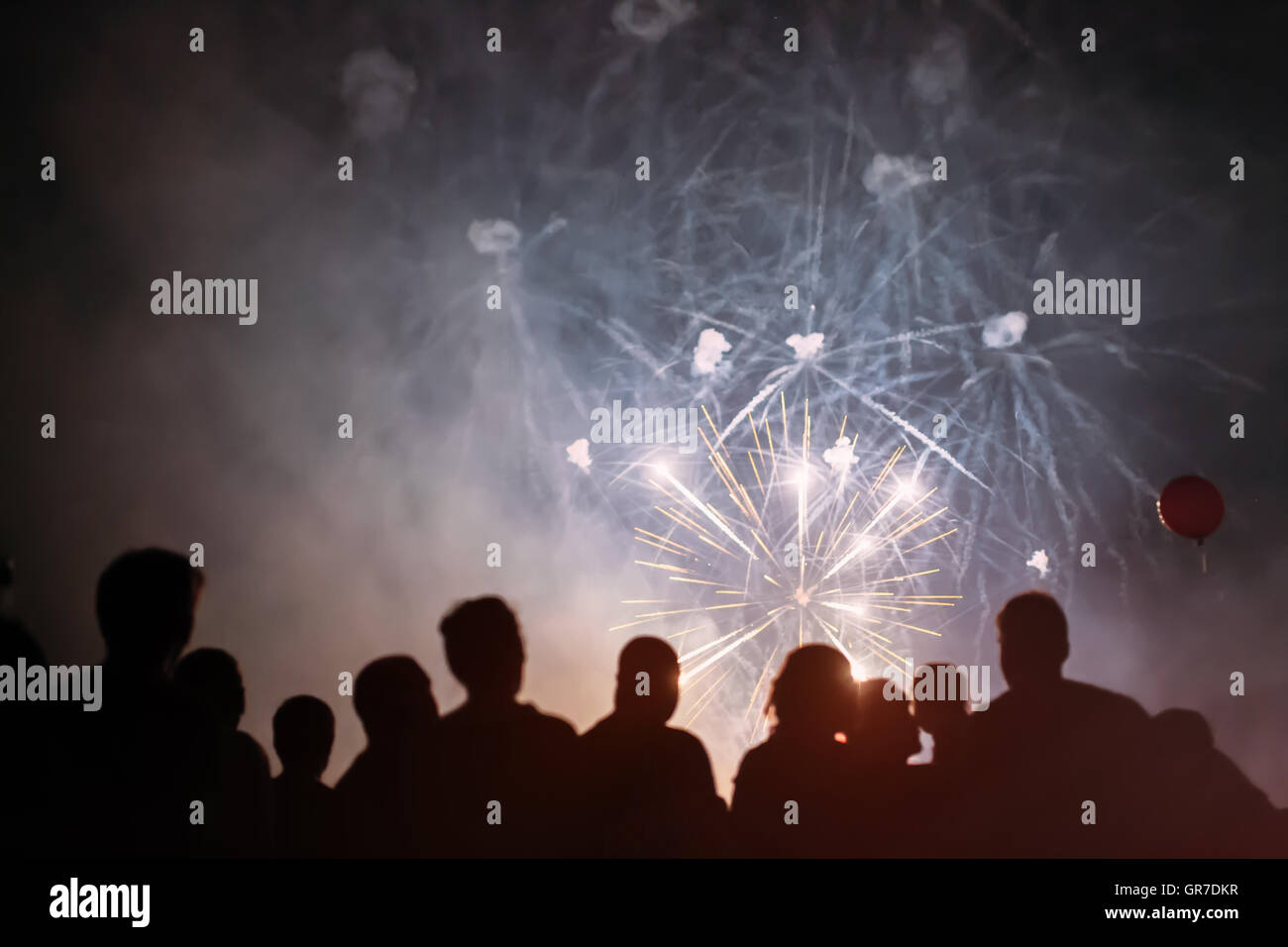 Crowd watching fireworks and celebrating Stock Photo - Alamy