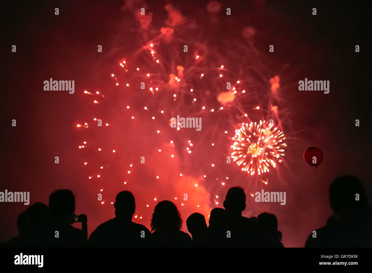Crowd watching fireworks and celebrating Stock Photo - Alamy