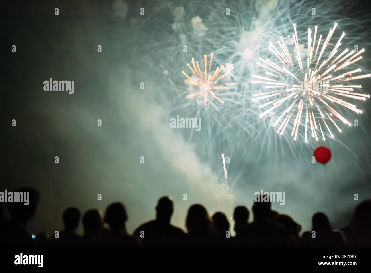 Crowd watching fireworks and celebrating Stock Photo - Alamy