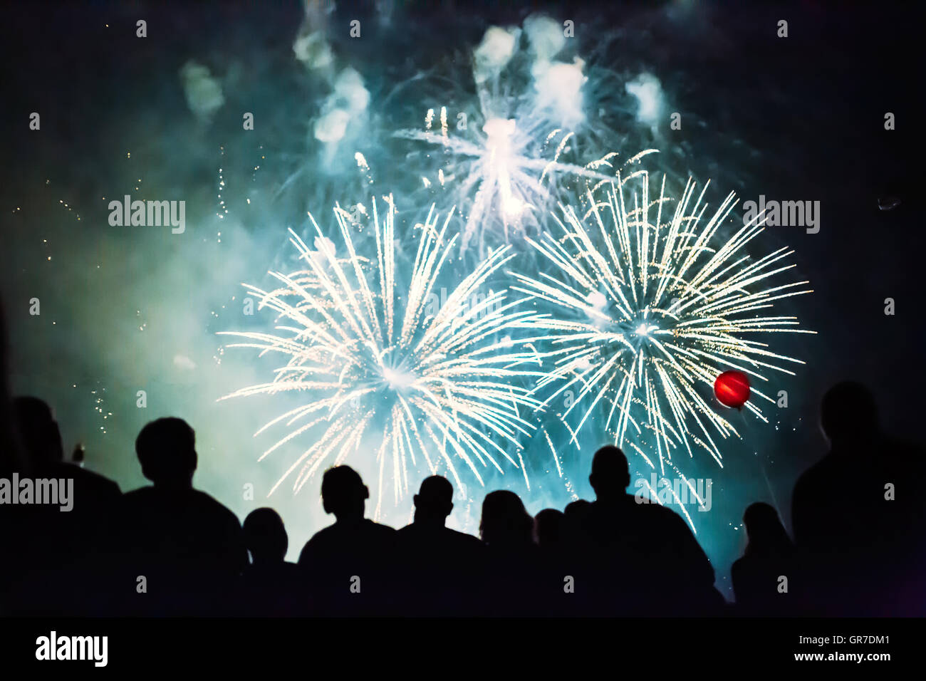 Crowd watching fireworks and celebrating Stock Photo - Alamy