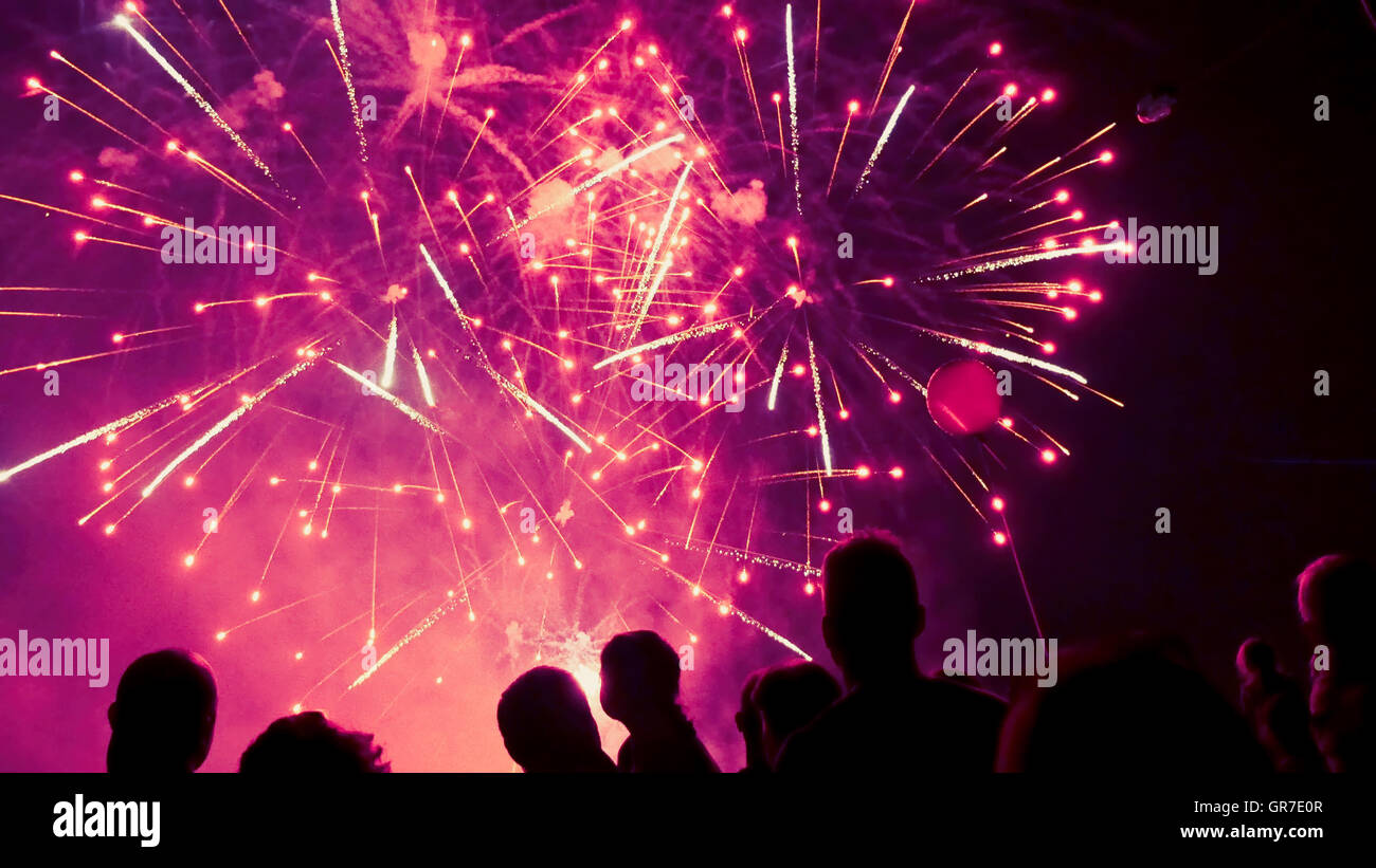 Crowd watching fireworks and celebrating Stock Photo - Alamy