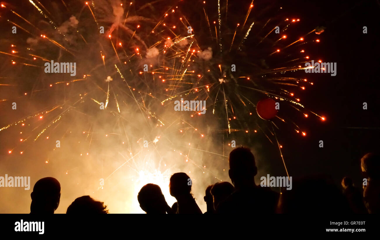 Crowd watching fireworks and celebrating Stock Photo - Alamy