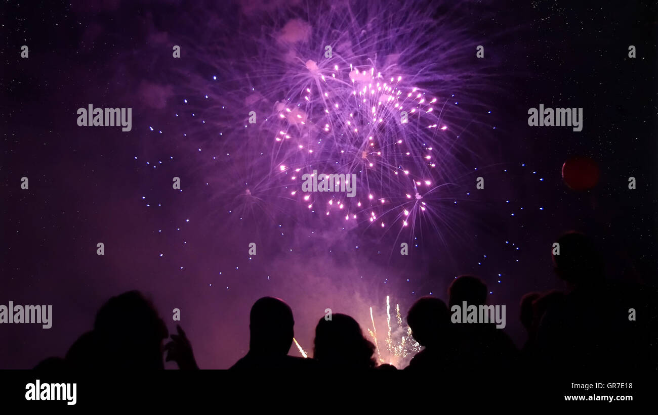 Crowd watching fireworks and celebrating Stock Photo - Alamy