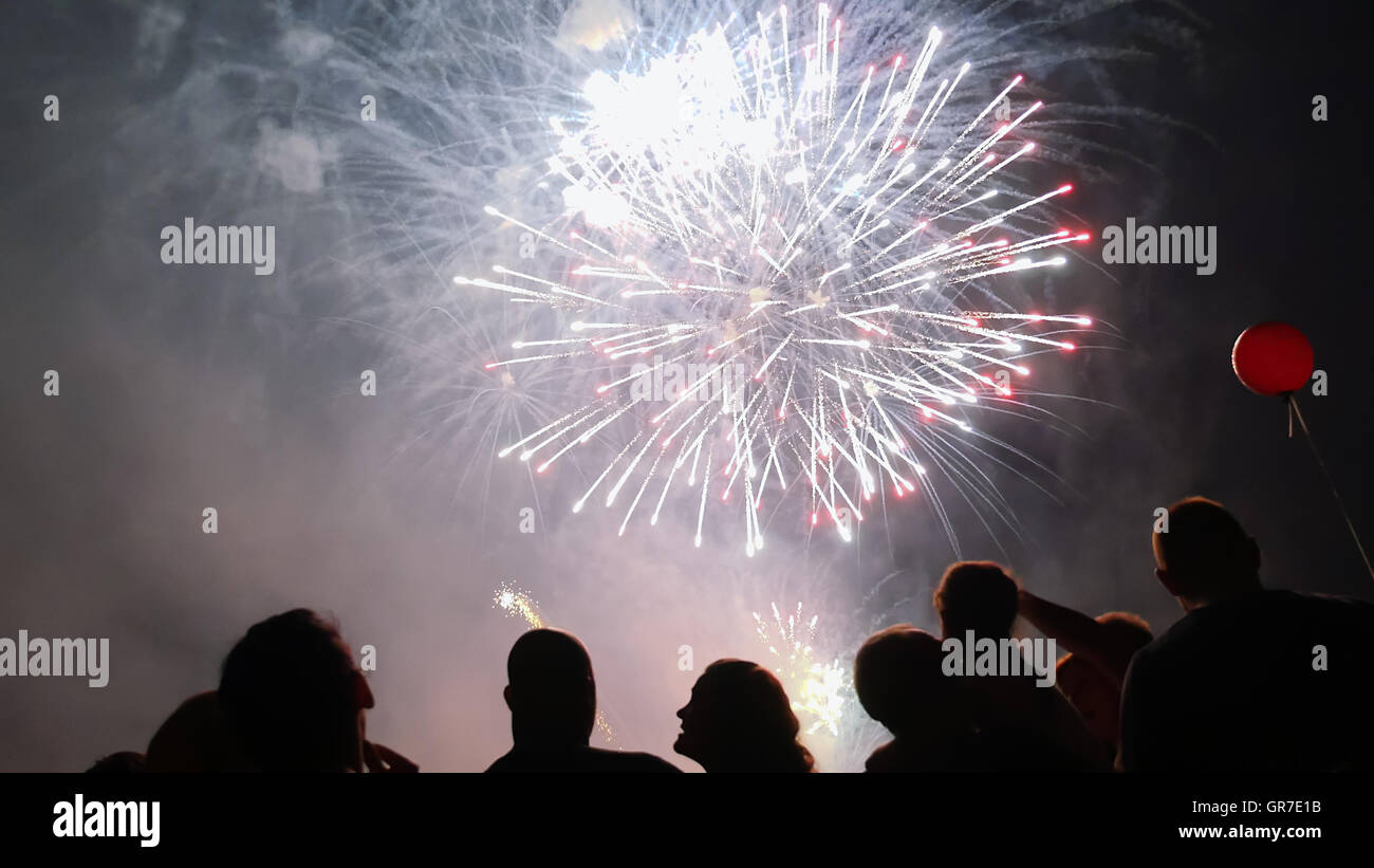 Crowd watching fireworks and celebrating Stock Photo - Alamy