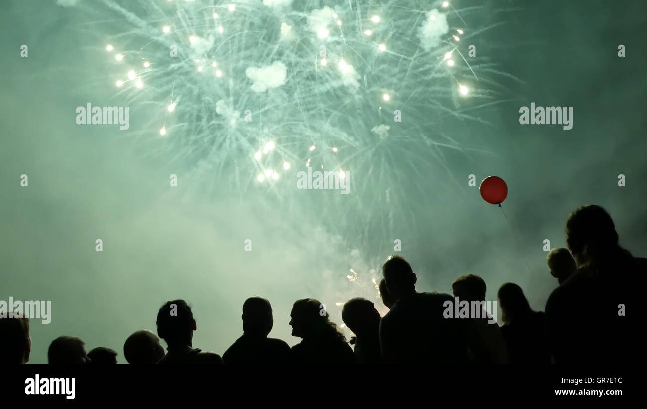 Crowd watching fireworks and celebrating Stock Photo - Alamy
