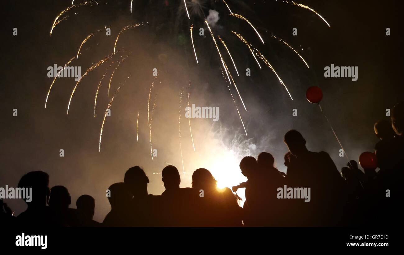Crowd watching fireworks and celebrating Stock Photo - Alamy