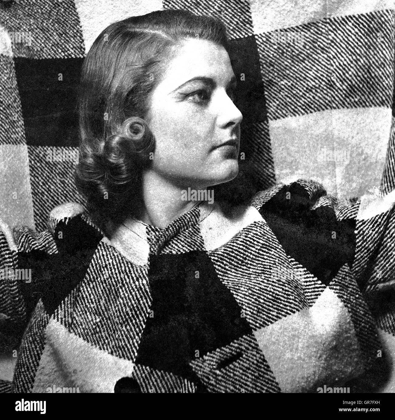 1940's Portrait of a woman in chequered (checked) clothing with ...
