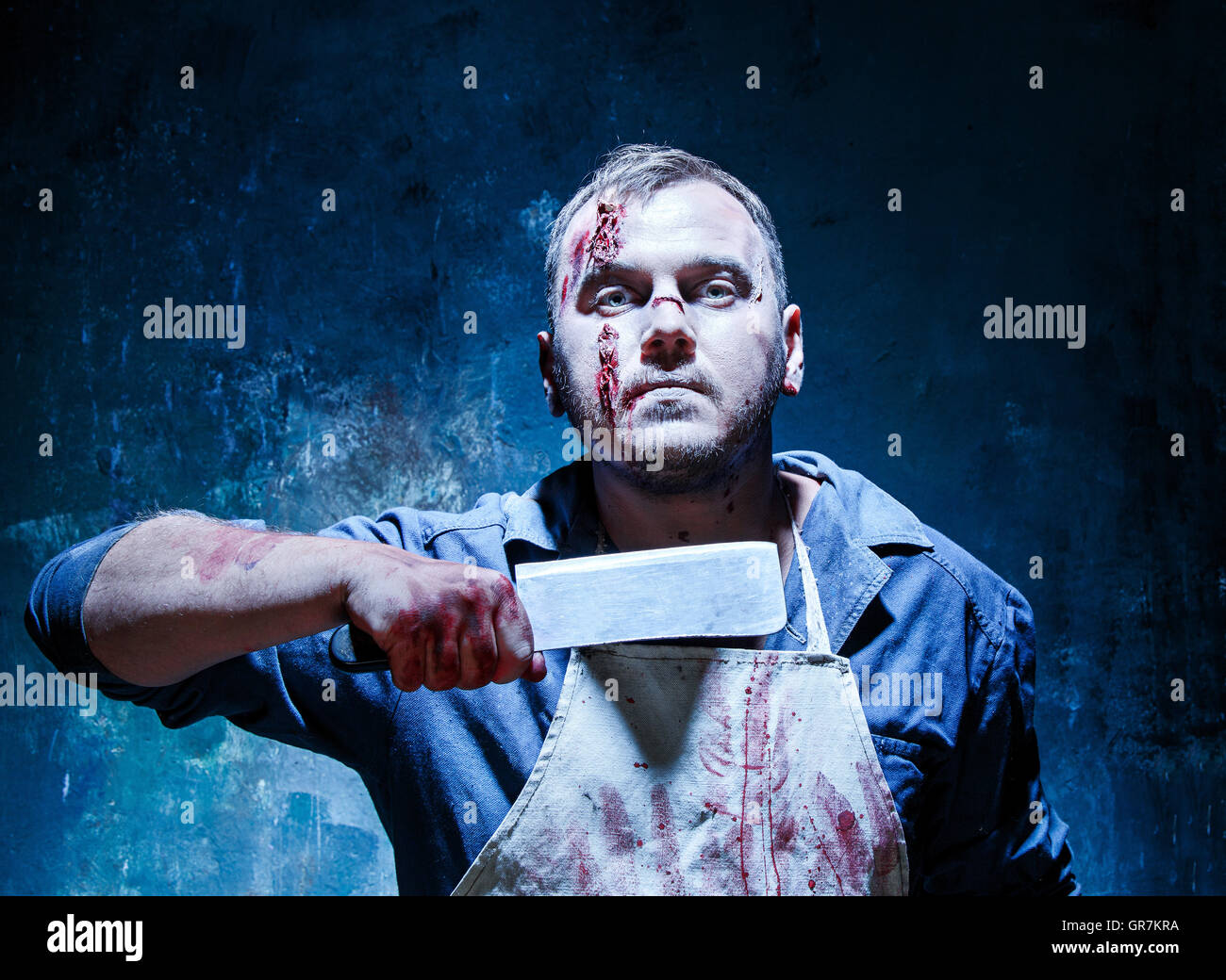 Bloody Halloween theme: crazy killer as butcher with a knife Stock ...