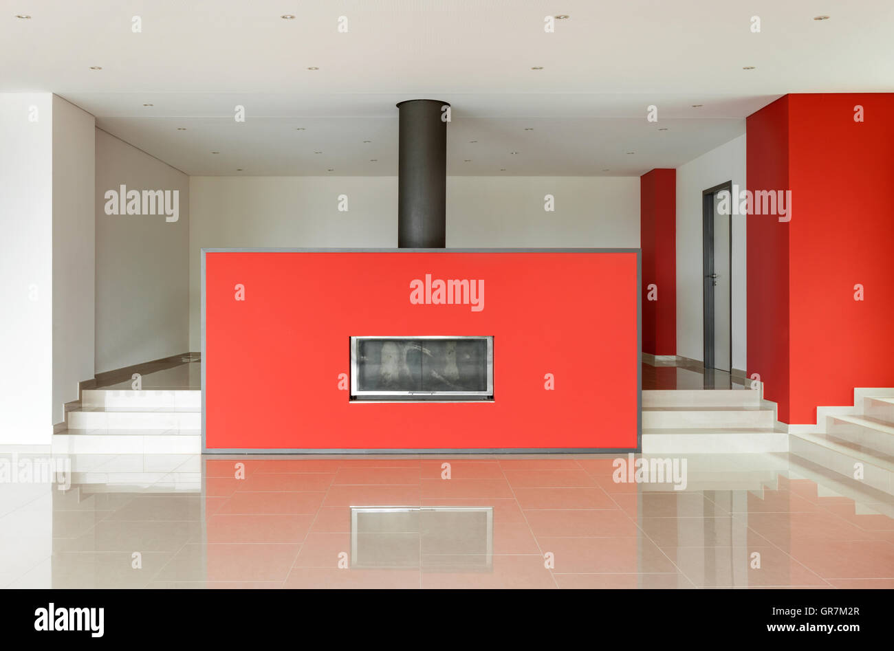 Interior modern villa, wide living room, red walls Stock Photo - Alamy