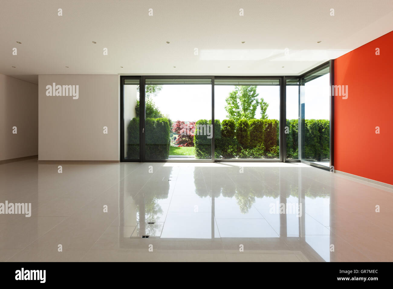 Interior modern villa, wide living room with windows Stock Photo - Alamy