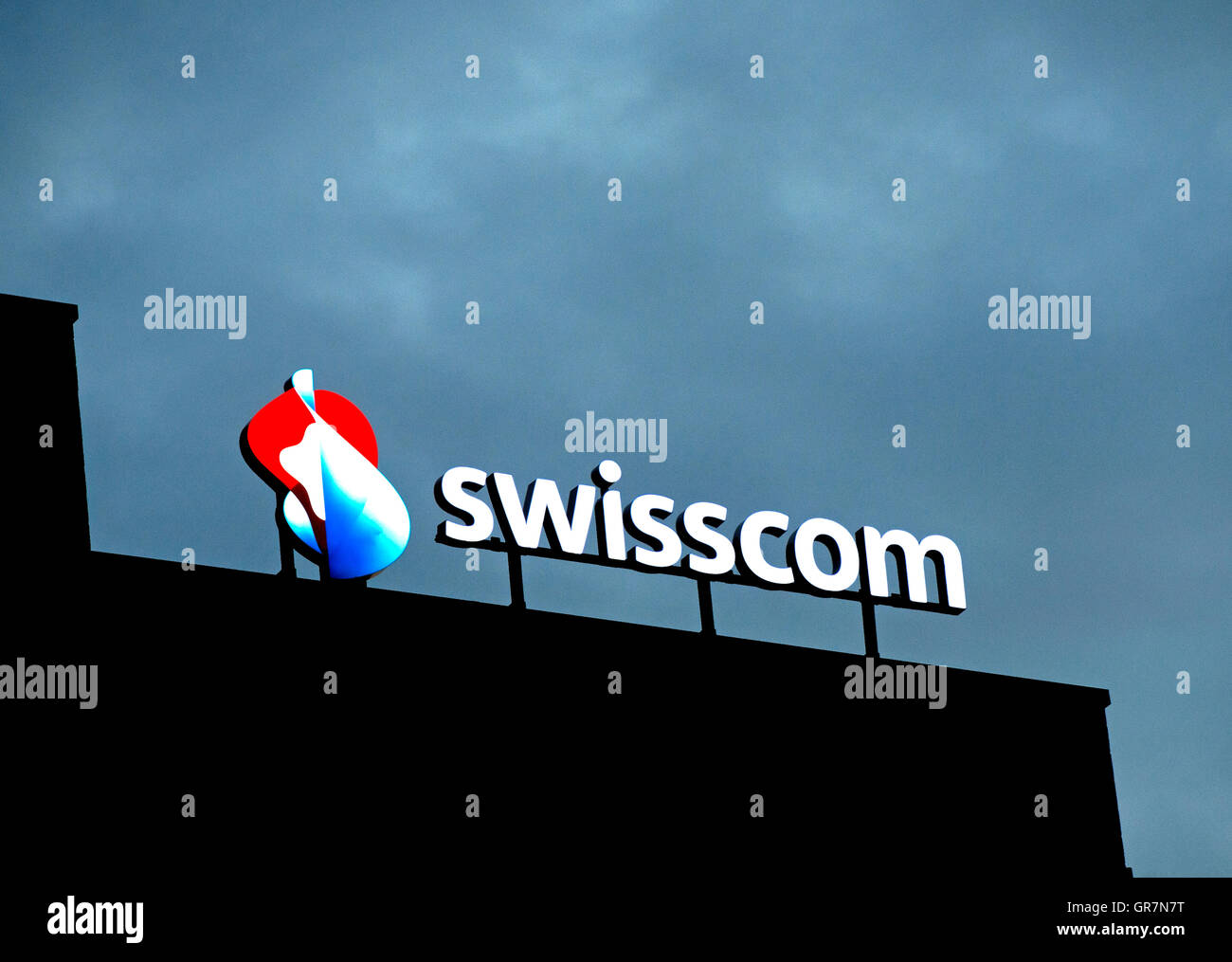 Neon Sign Of The Swiss Telecommunications Provider Swisscom Under Dark ...