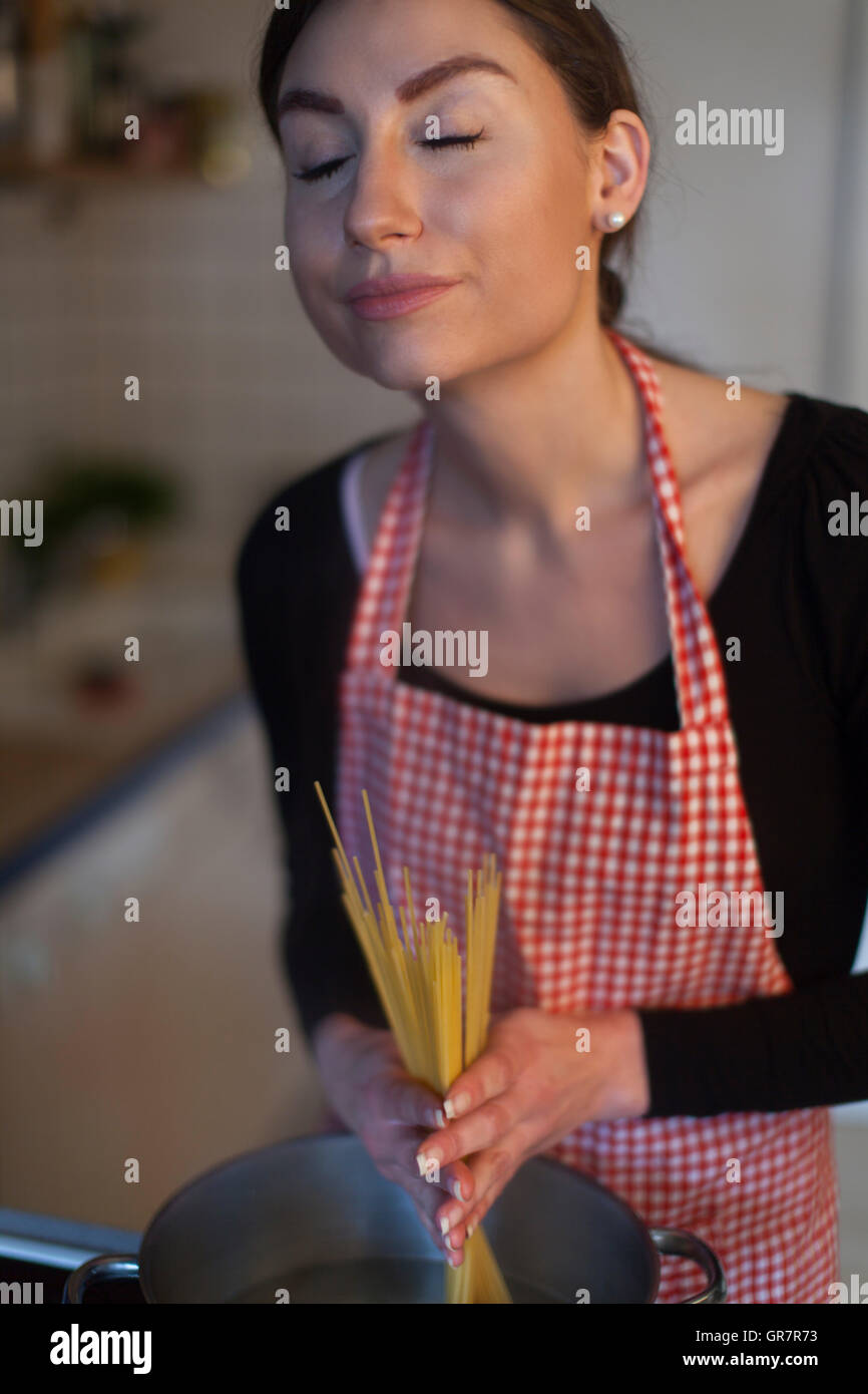 Woman Cooking Spaghetti Stock Photo - Alamy