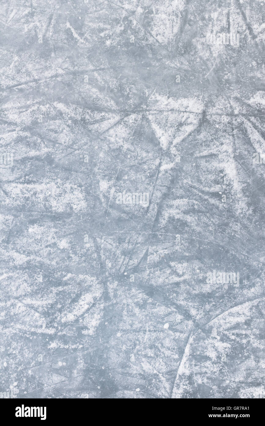 Details of an ice skating rink, with marks and scratches of skate ...