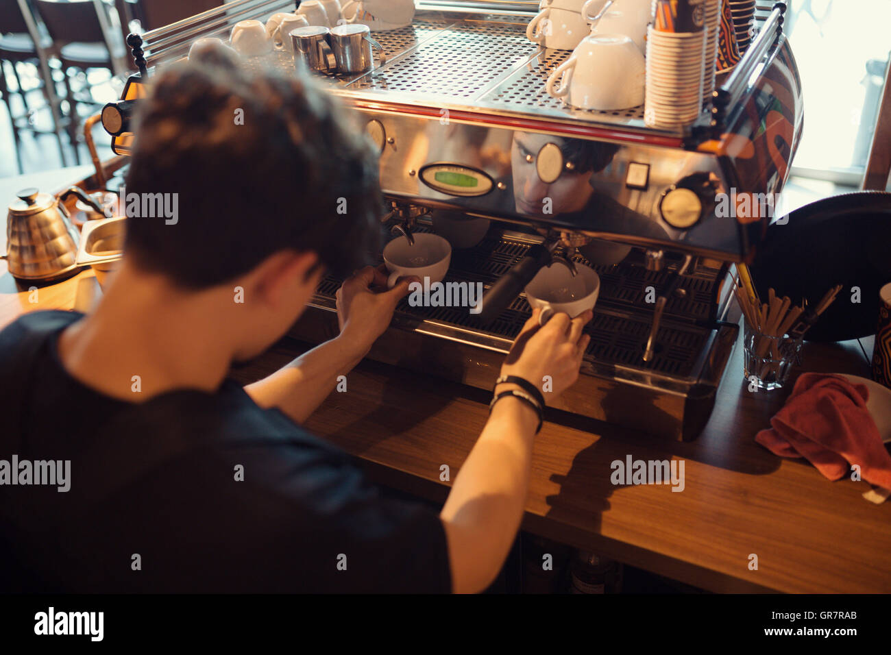 Barista at work in a coffee shop Stock Photo - Alamy