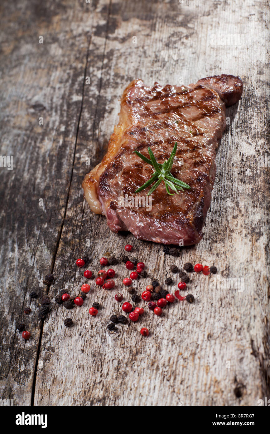 Steak On Wood Stock Photo - Alamy