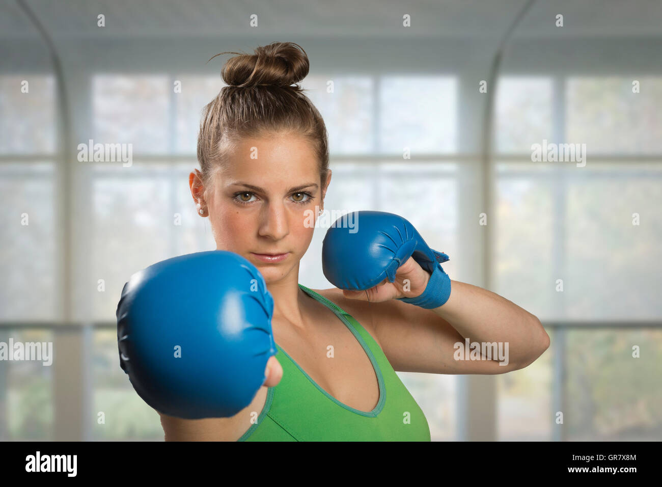 Young Woman With Boxing Gloves Showing Ready For Battle Stock Photo - Alamy