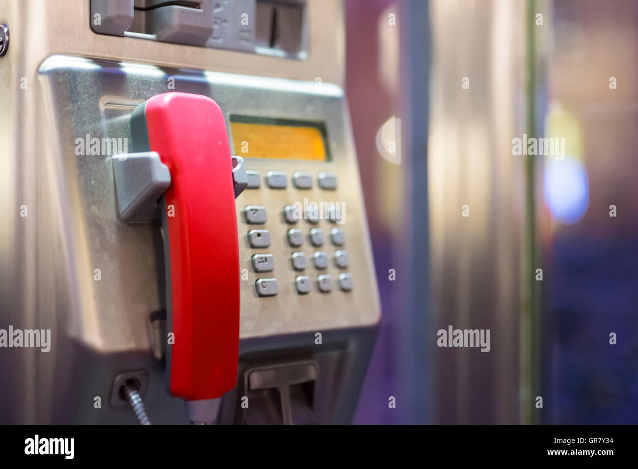 Red Handset And Keyboard Of An Old Payphone On The Night Stock Photo ...