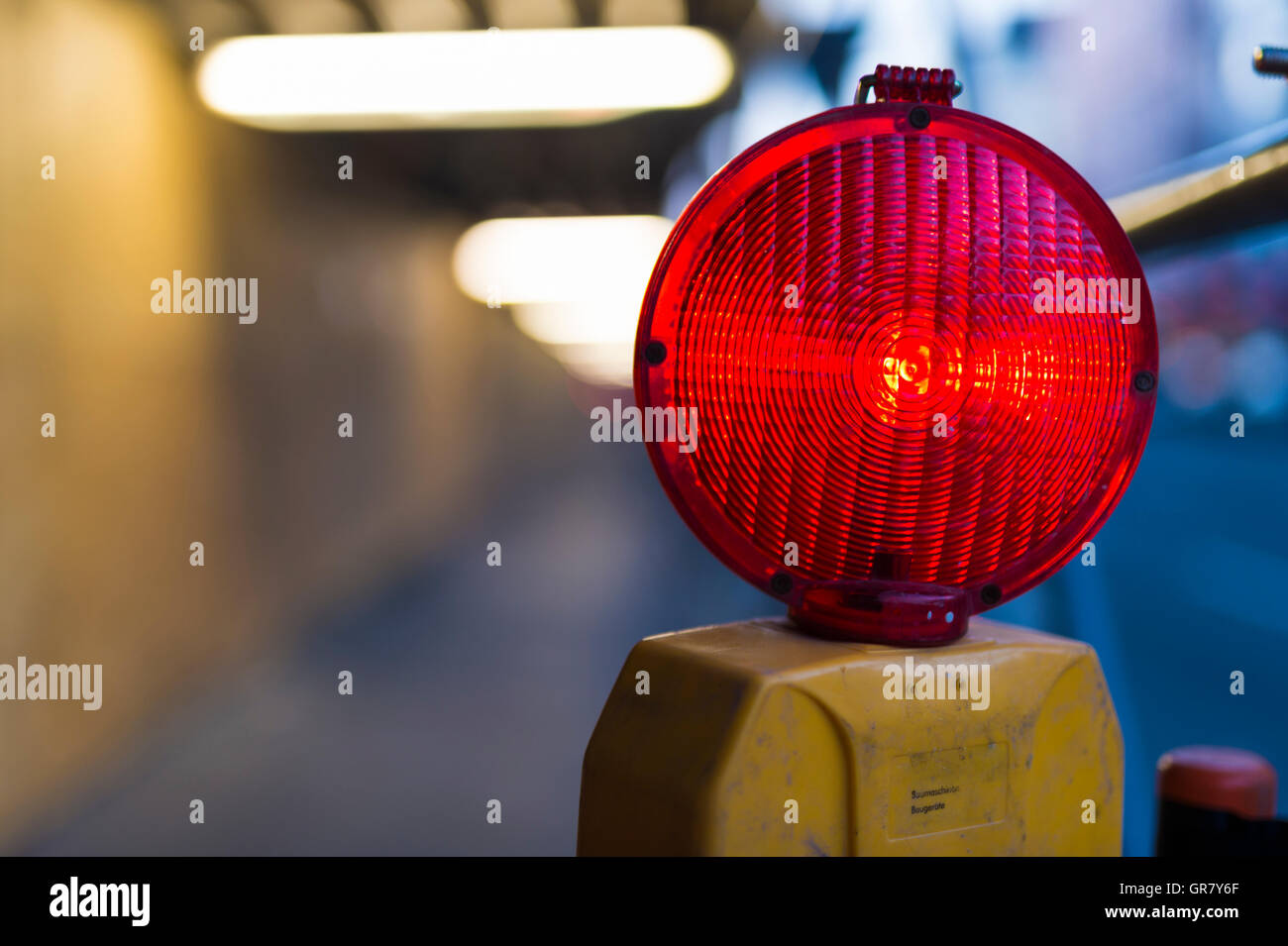 Red Warning Light In Front Of A Construction Site Stock Photo - Alamy