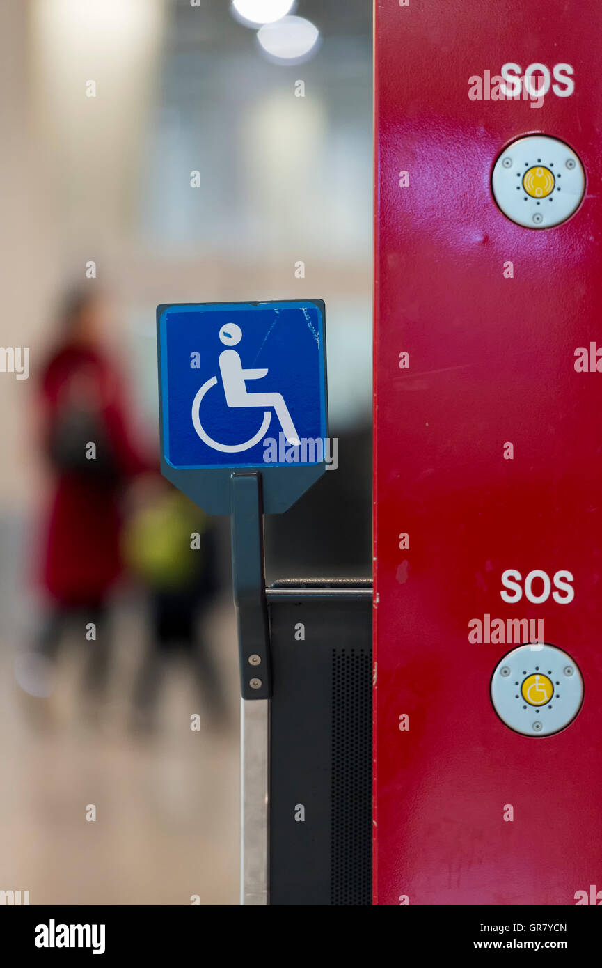 A Column With Emergency Call Facility And A Sign For Wheelchairs Stock ...