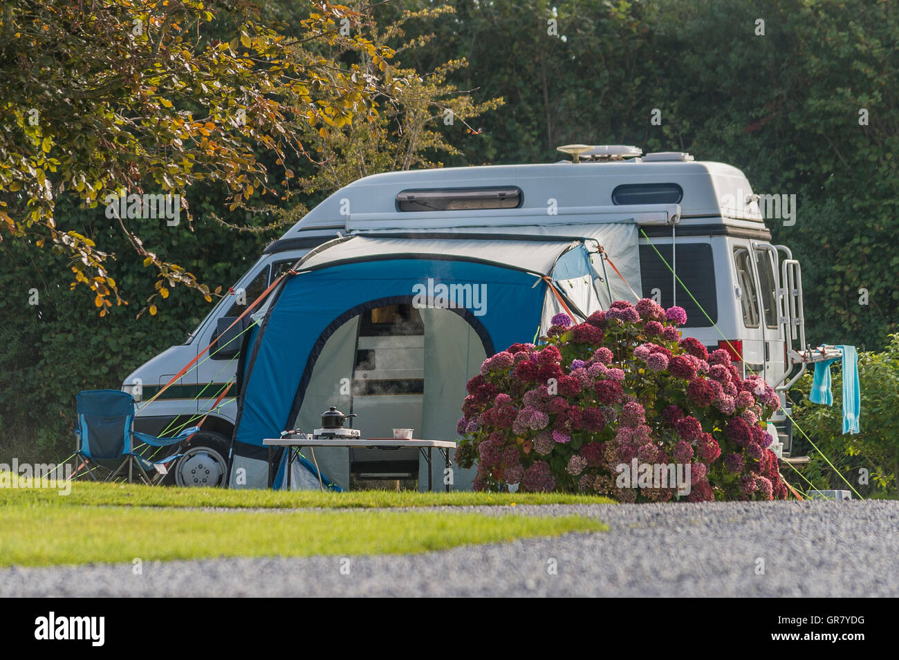 A Caravan With Awning Stands At A Campsite Stock Photo - Alamy