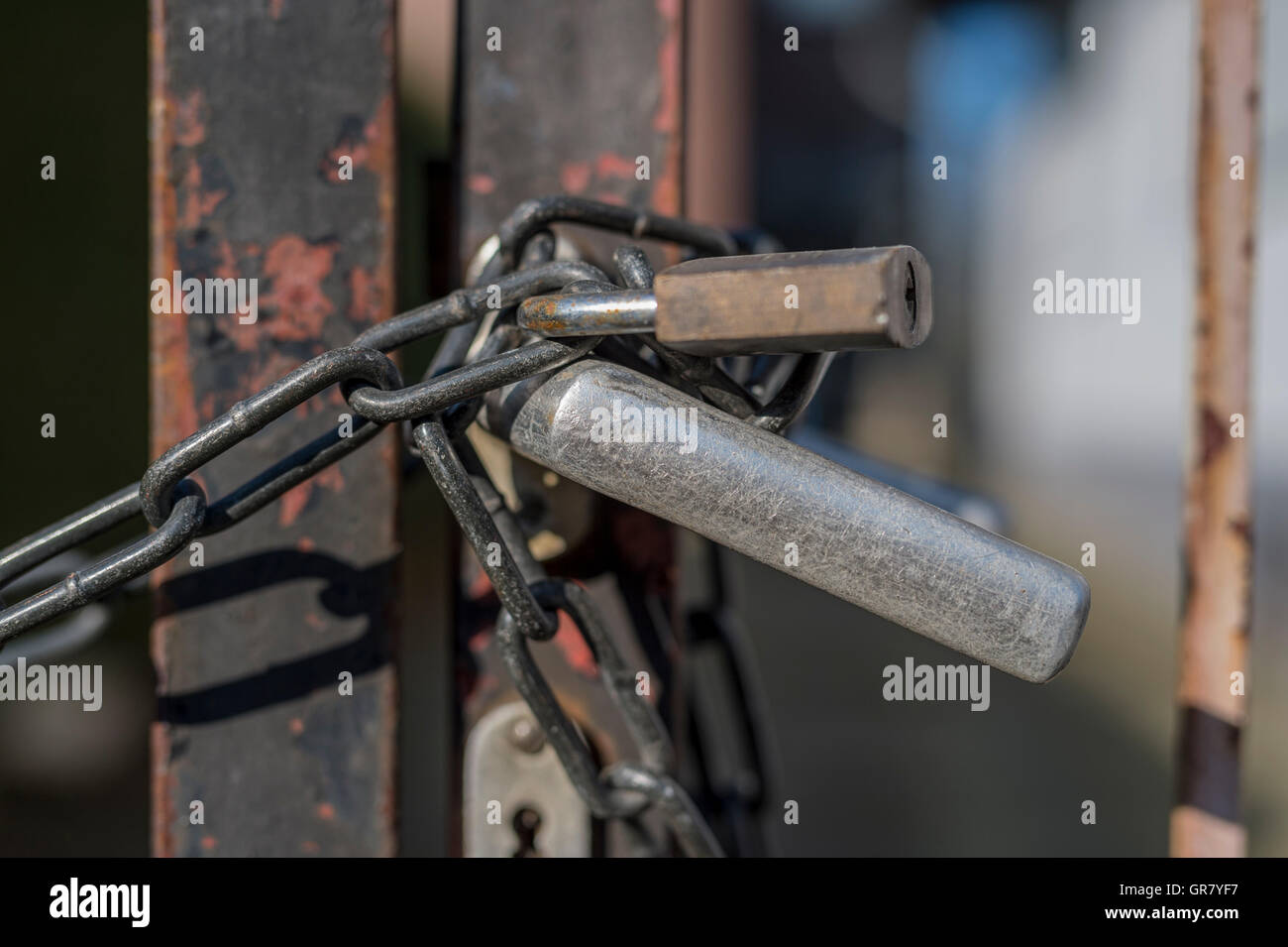A Locked With Chain And Padlock Gate Stock Photo - Alamy