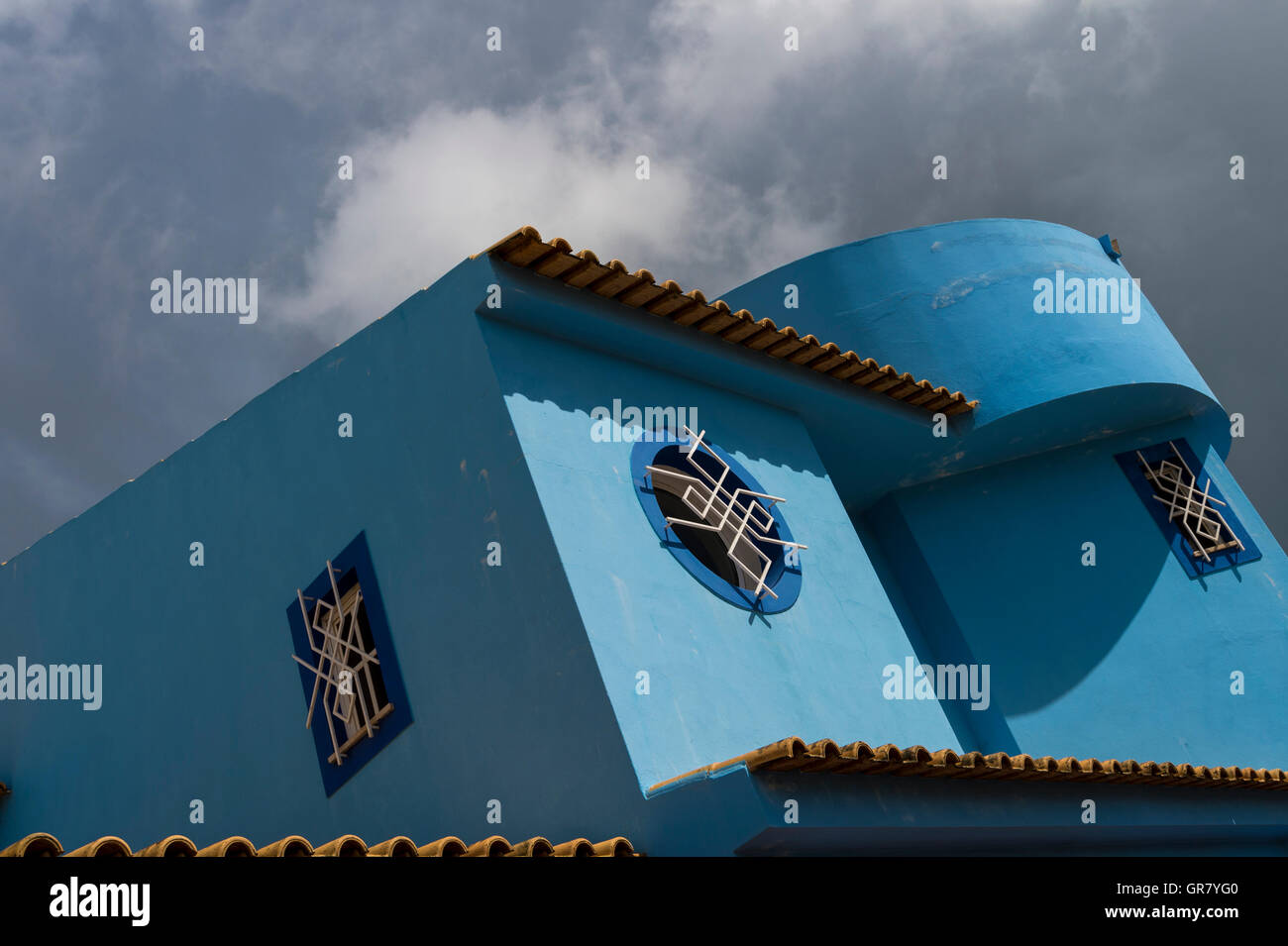 Blue House In The Sunshine Stock Photo - Alamy