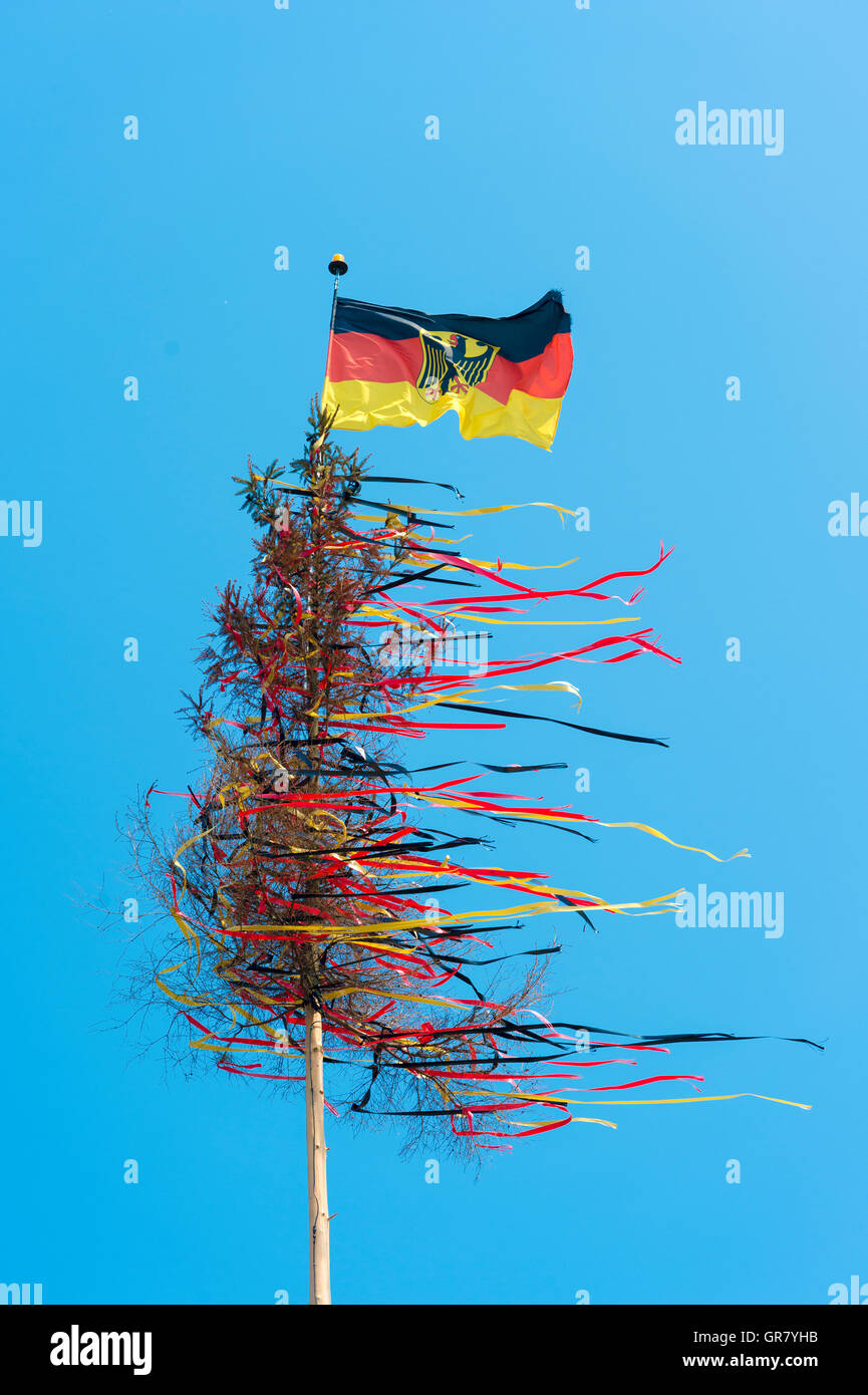 The German Flag At The Top Of A Beribboned Tree Stock Photo - Alamy