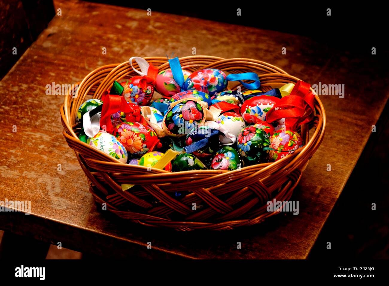 Colorful Easter Eggs In Basket Stock Photo - Alamy