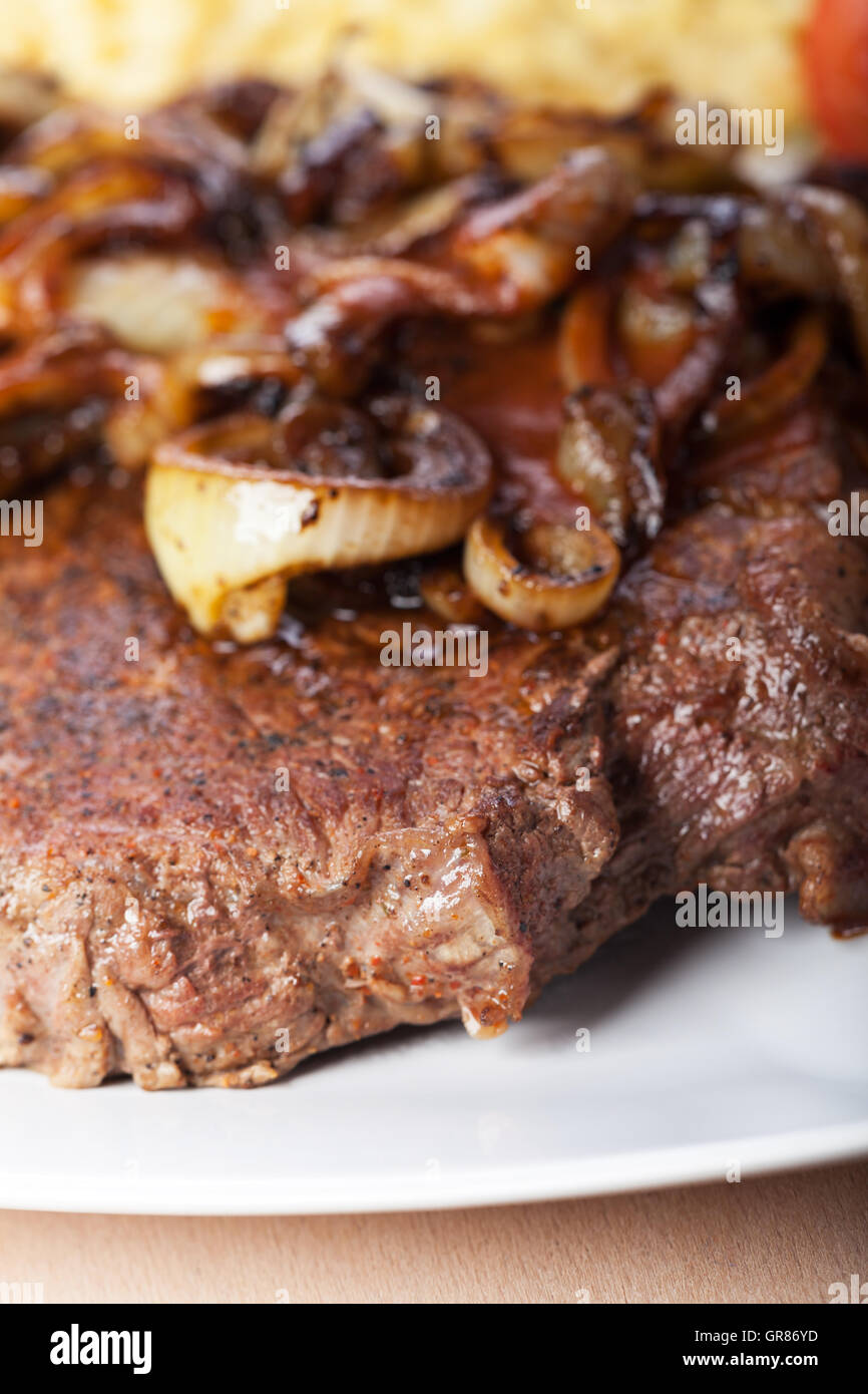 Steak With Onions Stock Photo - Alamy