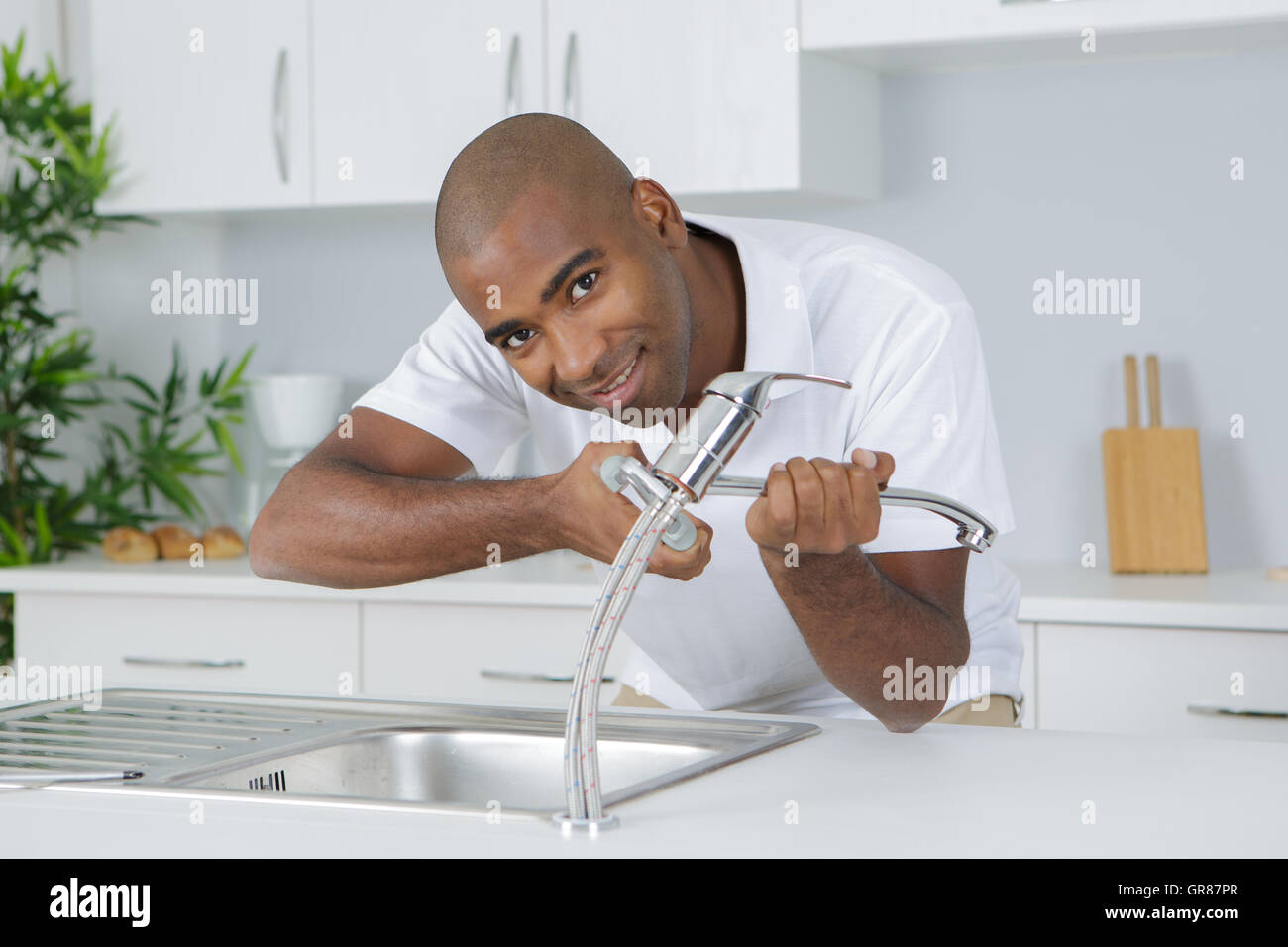 fixing a sink Stock Photo - Alamy