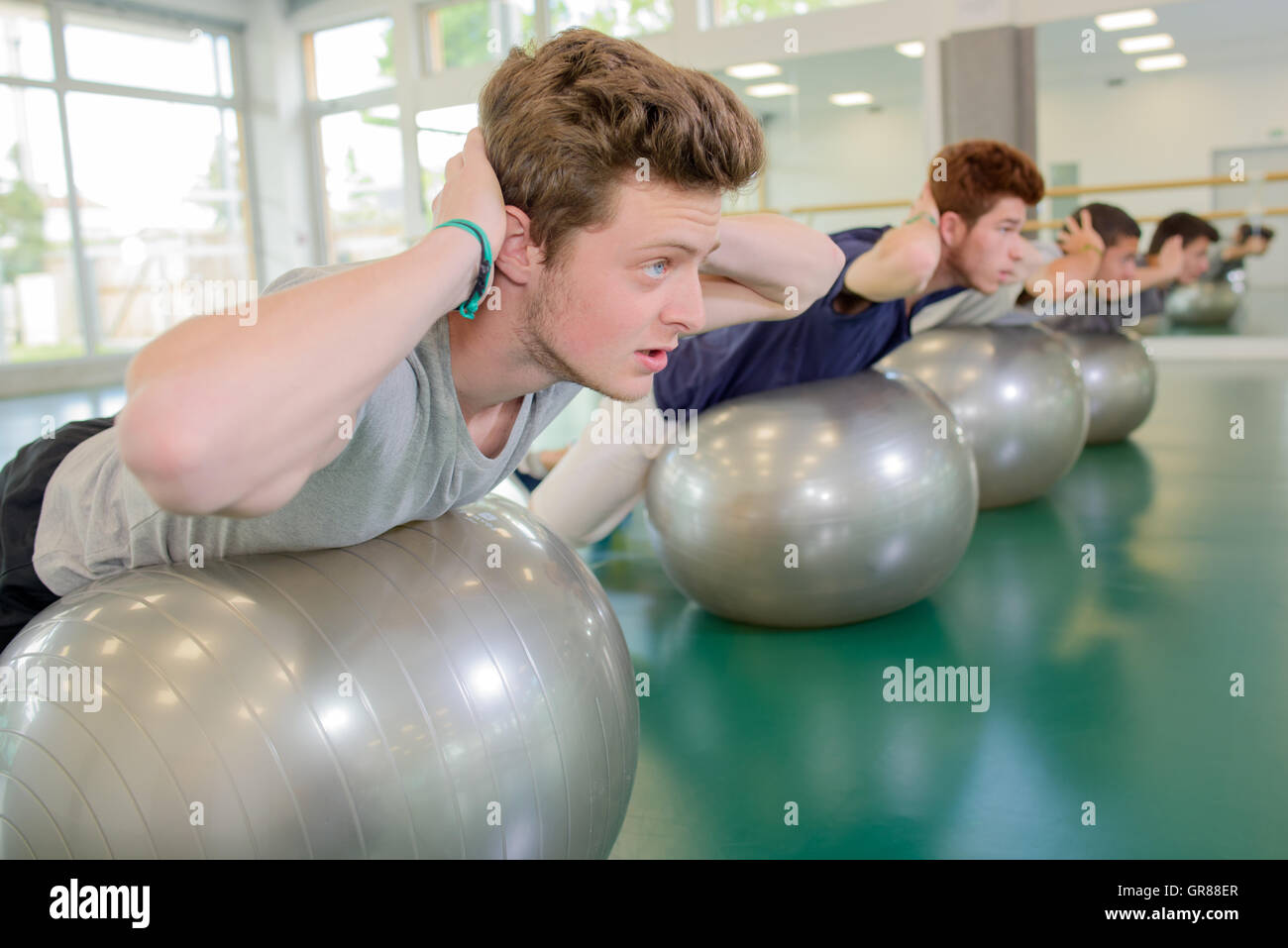 men on their gym ball Stock Photo - Alamy