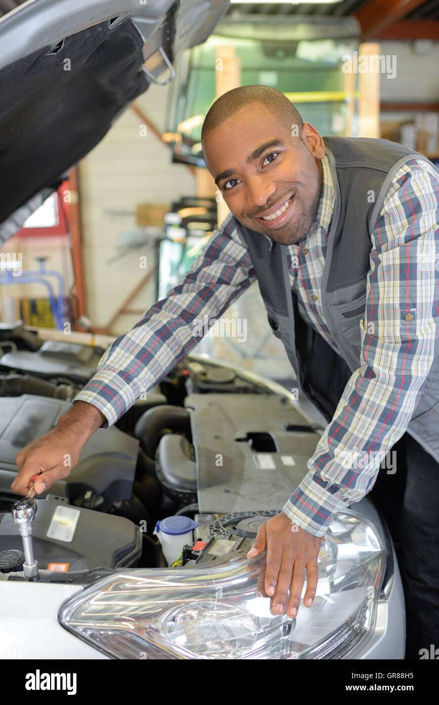 mechanic fixing a car Stock Photo - Alamy