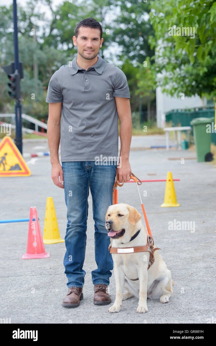 Portrait of man with guide dog Stock Photo - Alamy