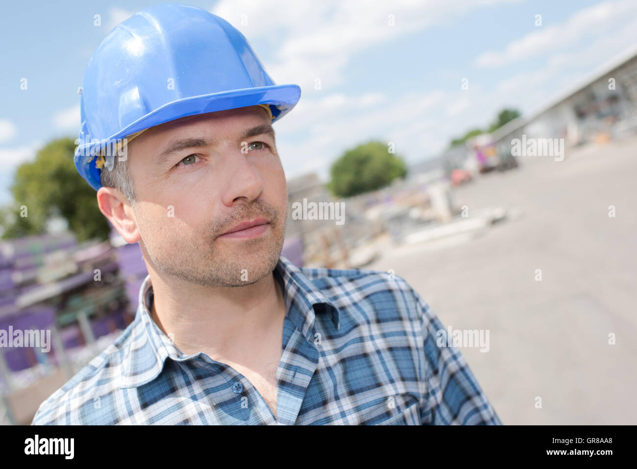 Portrait of man on construction site Stock Photo - Alamy