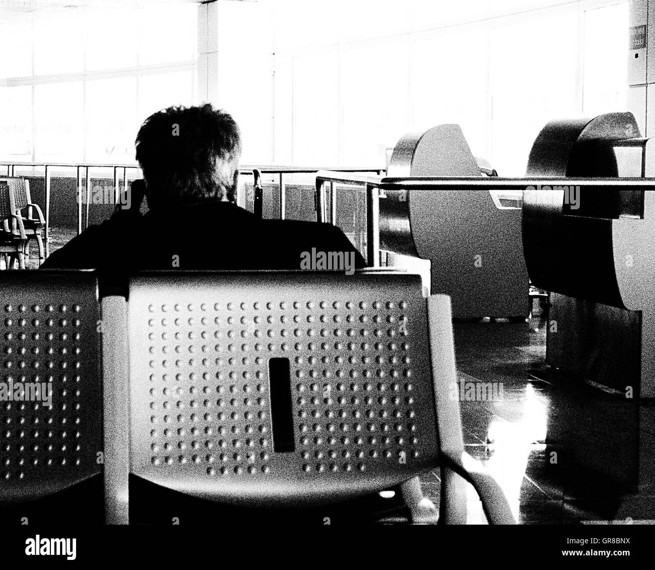 Man sitting chair and rear view Black and White Stock Photos & Images ...