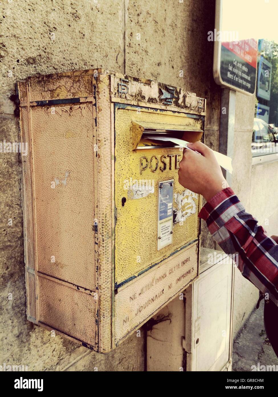 Cropped Hand Dropping Letter In Mailbox Stock Photo - Alamy