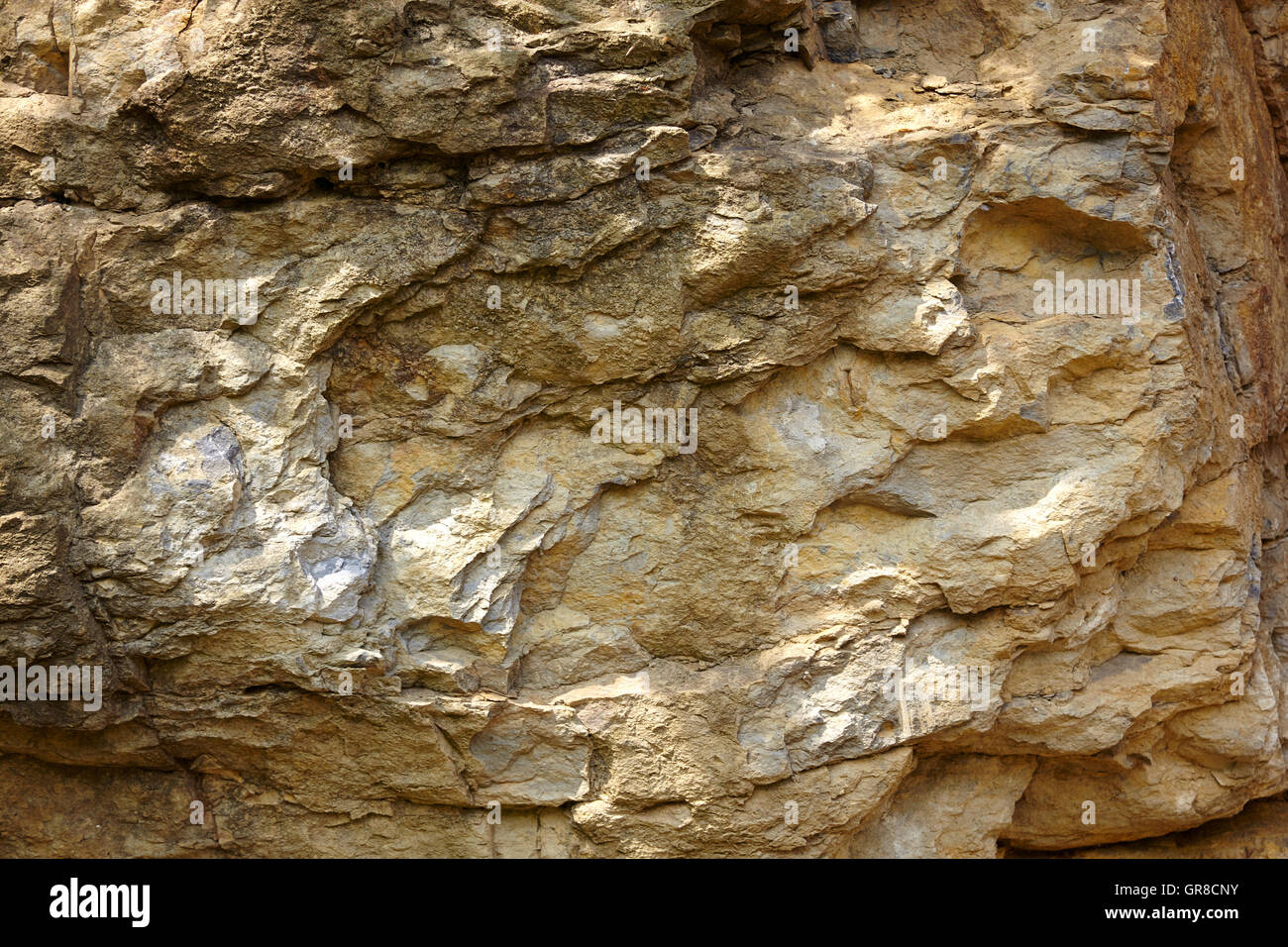 Rock Wall In The Sunlight Stock Photo - Alamy