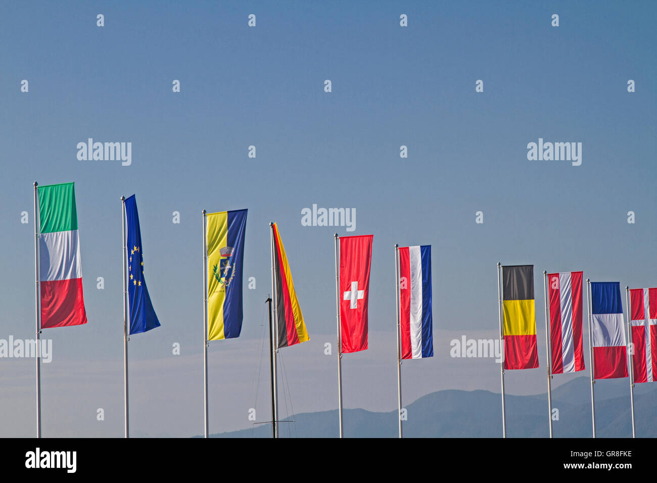 Flags Of Different Countries Against Blue Sky Stock Photo - Alamy