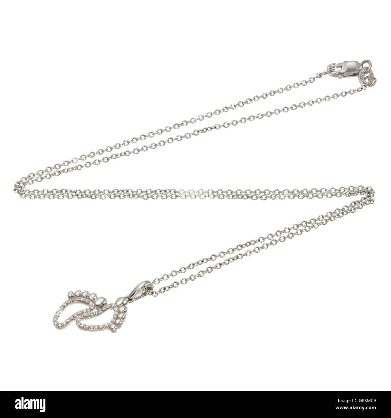 White gold chain with pendant in the shape of a legs Stock Photo - Alamy