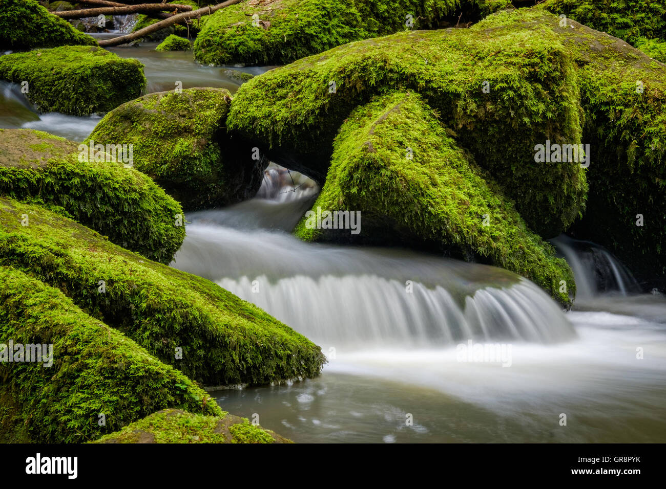 Small Waterfall With Rocks Stock Photo - Alamy