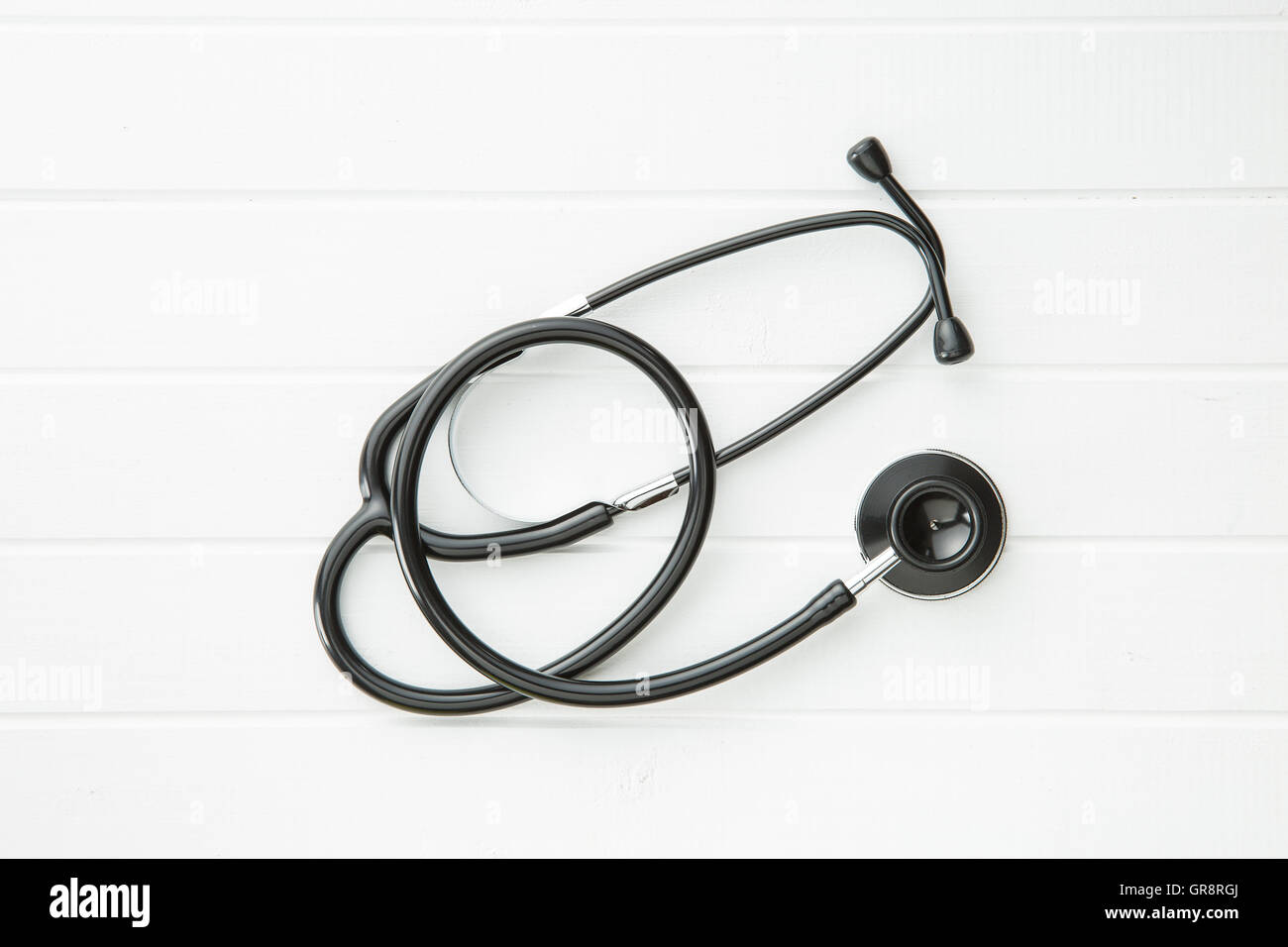 Stethoscope on white table. Top view Stock Photo - Alamy