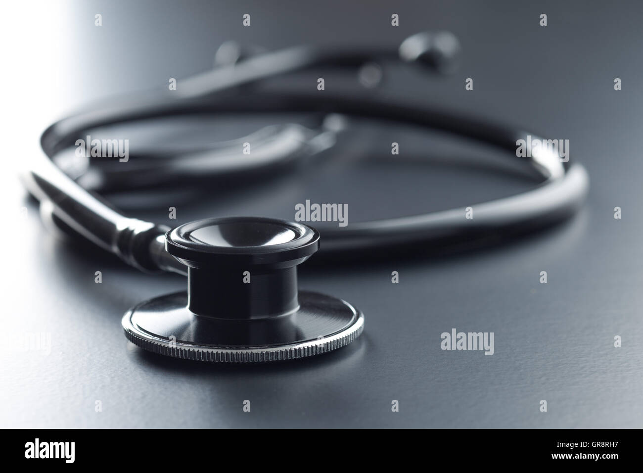 The stethoscope on black table Stock Photo - Alamy