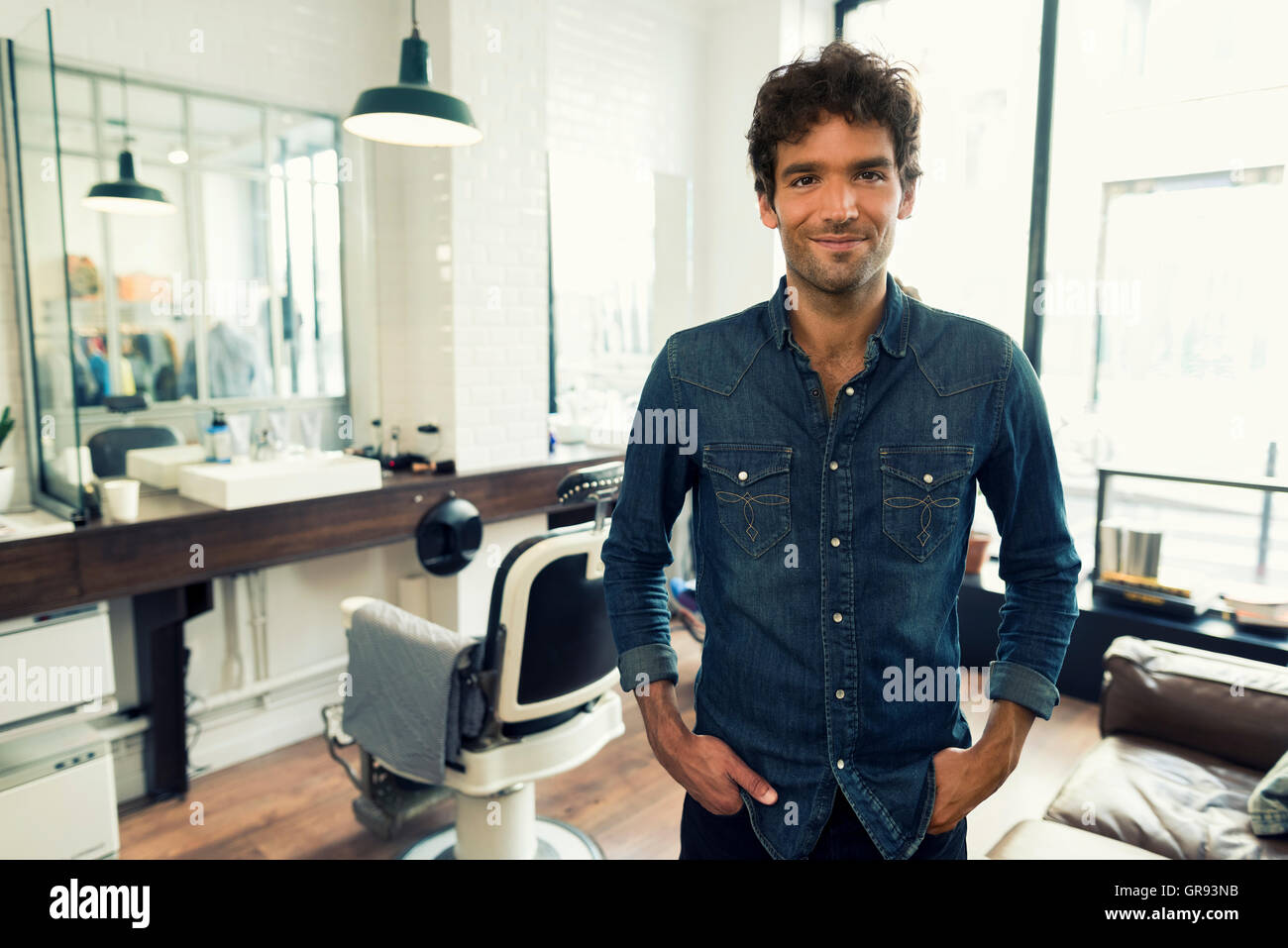 Portrait of successful male barber. Looking at camera Stock Photo - Alamy