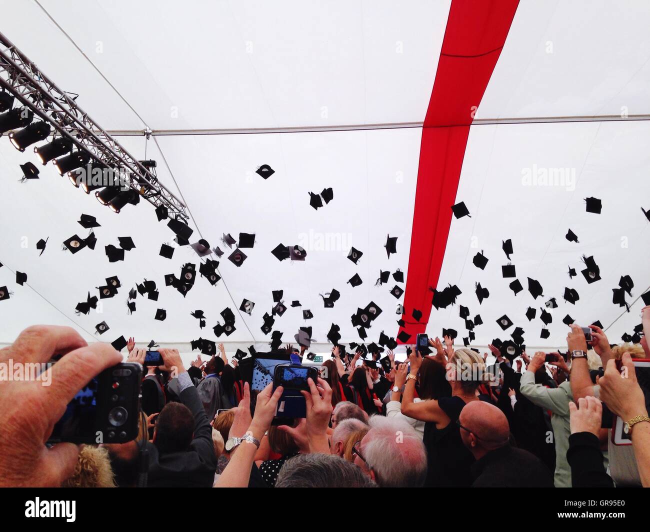Graduation caps in air hi-res stock photography and images - Alamy