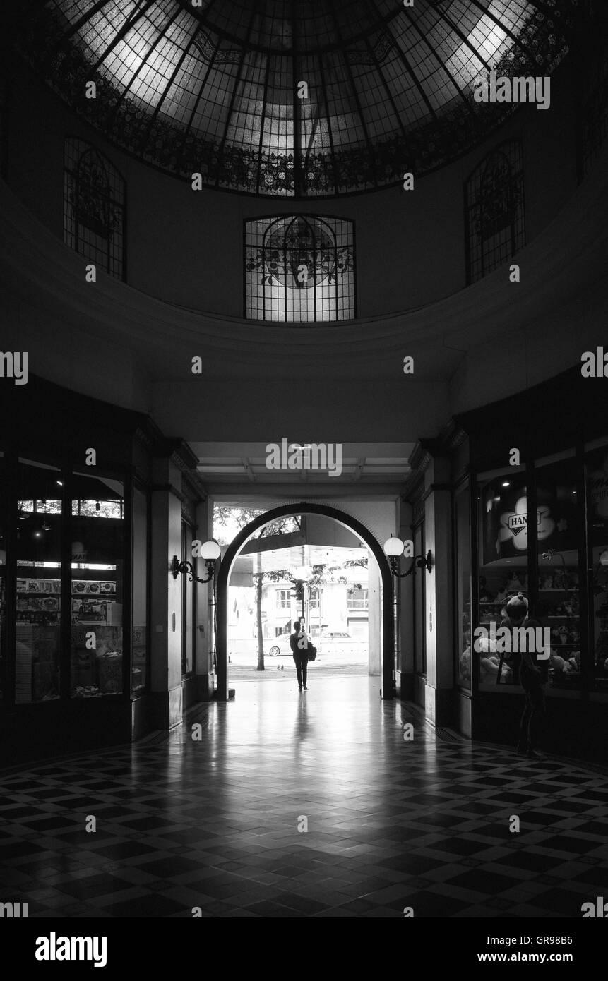 Rear View Of Person Exiting Building Stock Photo - Alamy