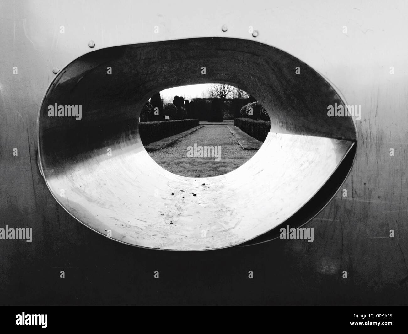 Park Seen Through Hole In Metal Stock Photo - Alamy