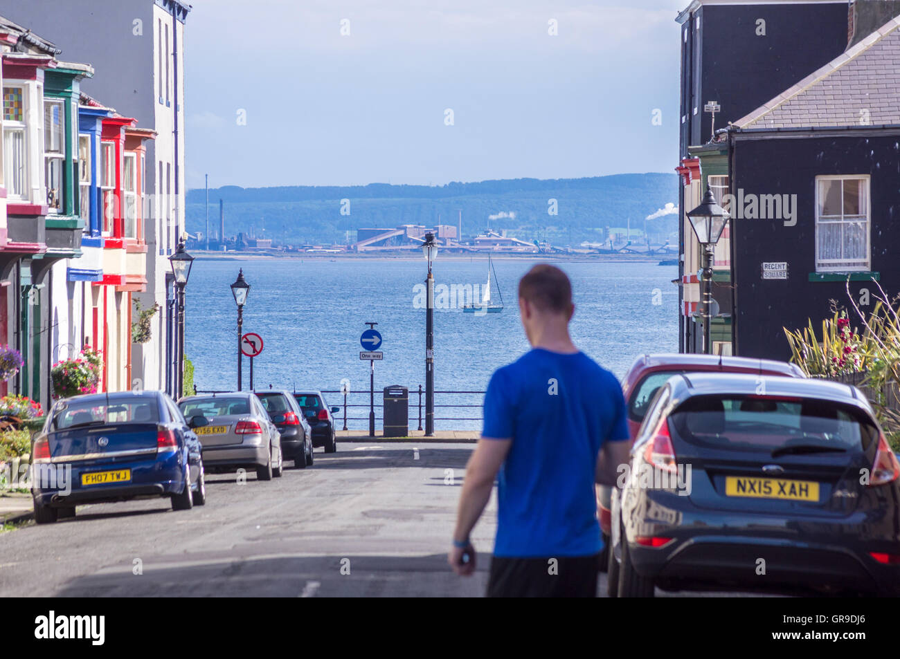 A yacht in Hartlepool Bay seen from a street of Victorian terraced ...